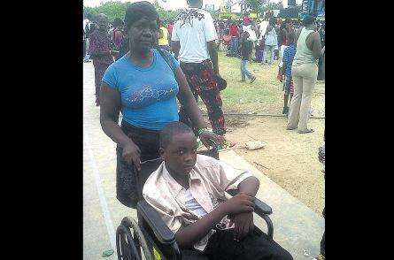 Needy mother and son seek help at popular back-to-school fair - Jamaica ...