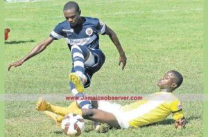 Photo: Deadly slide tackle - Jamaica Observer