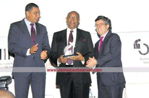 Photo: Lowe wins IDB award - Jamaica Observer