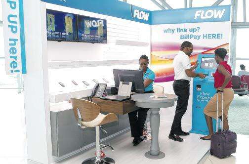 FLOW opens full service centre at Norman Manley International - Jamaica ...
