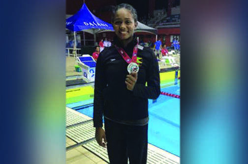 Jamaican Emily MacDonald mines gold at swimming champs - Jamaica Observer