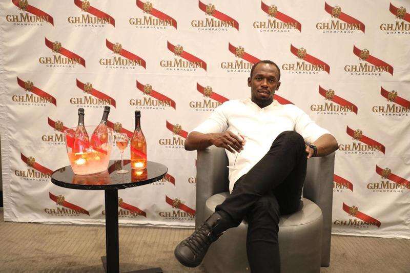 Bolt’s champagne post causing social media uproar - Jamaica Observer