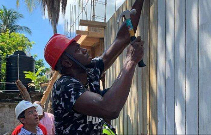 Usain Bolt helps to build house for Spanish Town fire victim - Jamaica ...