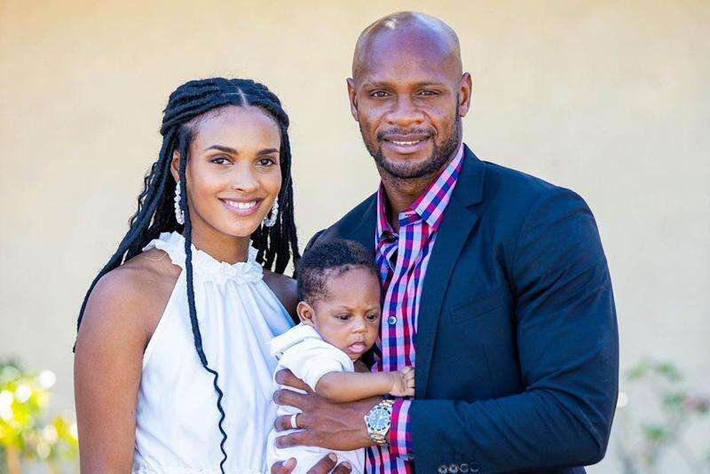 Asafa shares cute pictures of son’s christening - Jamaica Observer