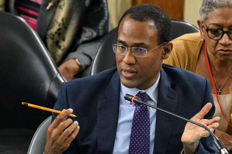 Dr Nigel Clarke uses dominoes to teach child Mathematics - Jamaica Observer