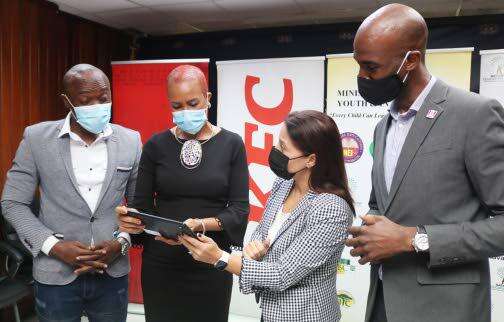 KFC adds hope with 100 tablets for students - Jamaica Observer