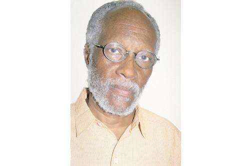Mikey Chung remained in the background - Jamaica Observer