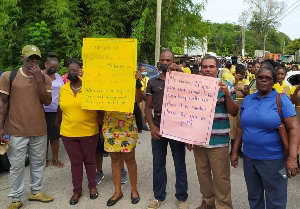 Protesting ancillary staff padlock gates at Anchovy High - Jamaica Observer