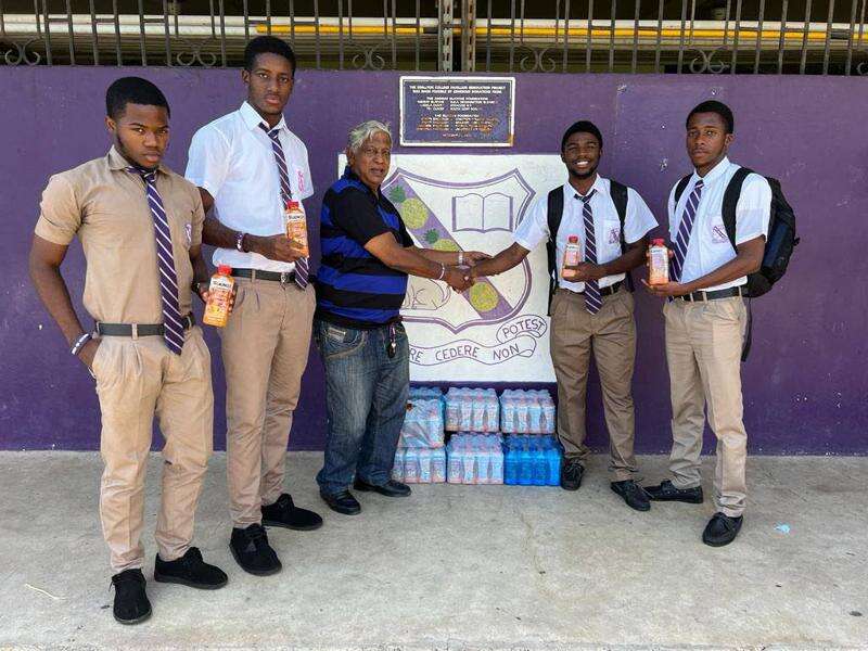 Qualcare donates to KC track team - Jamaica Observer