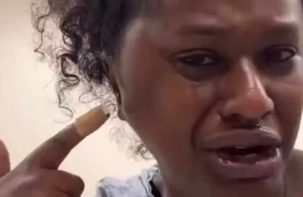 'Brick Lady' charged with making false claims 'vacationing in Jamaica ...