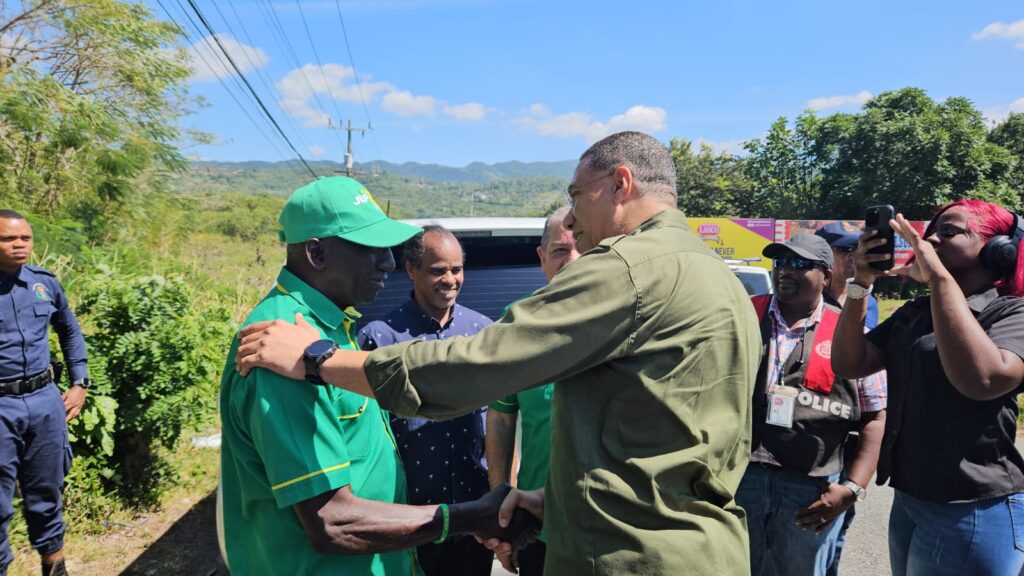 PM touring sections of Manchester as part of JLP election campaign ...