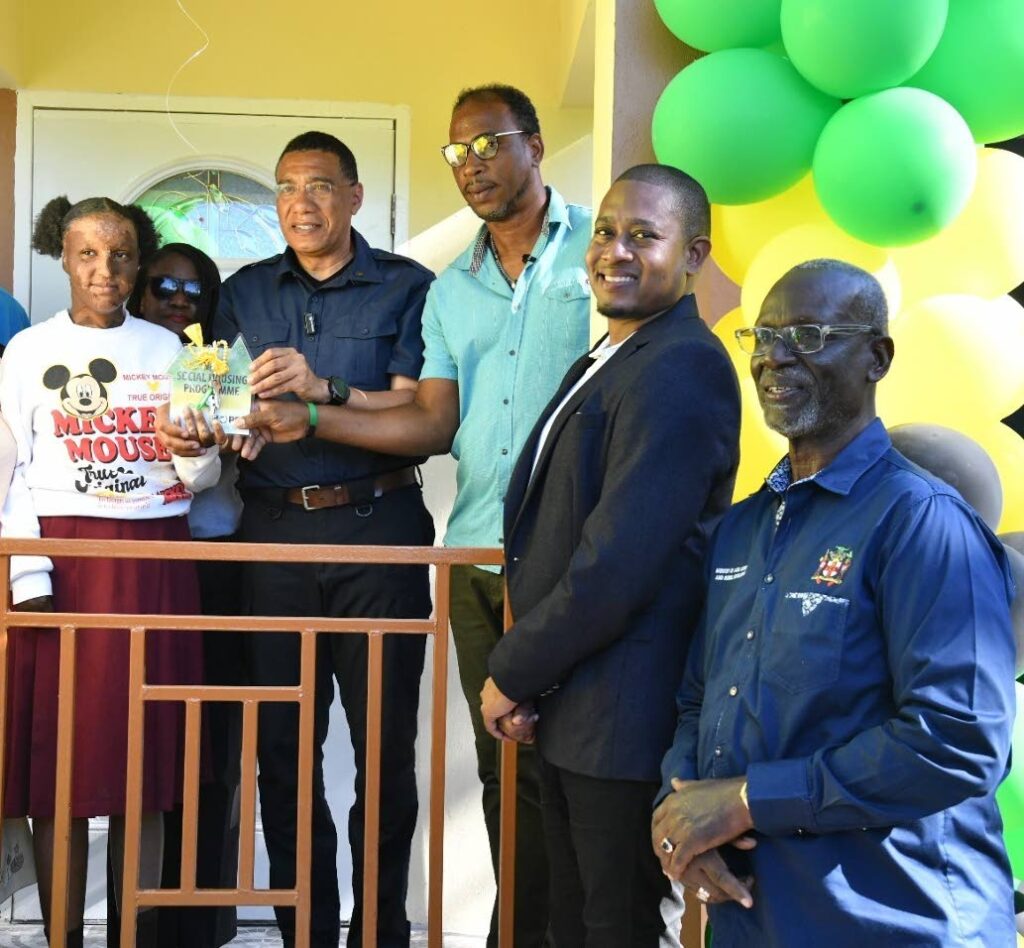 Burn victim, dad elated for new house - Jamaica Observer
