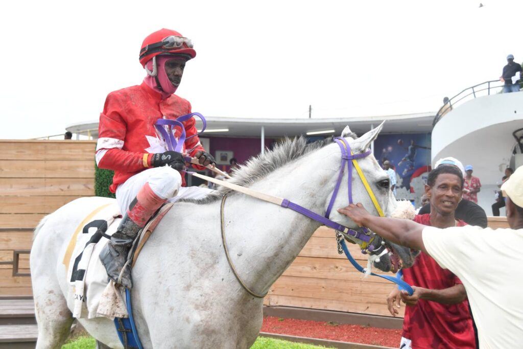 Phillip Parchment returns to the winners’ enclosure after injury ...