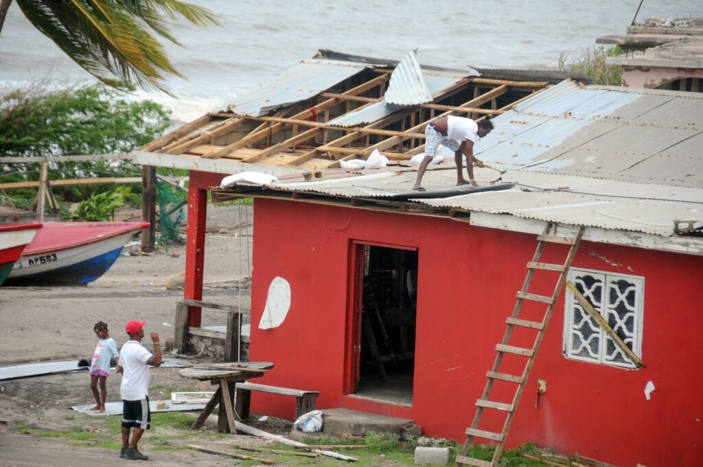 PM promises to assist needy householders with roof repairs - Jamaica ...
