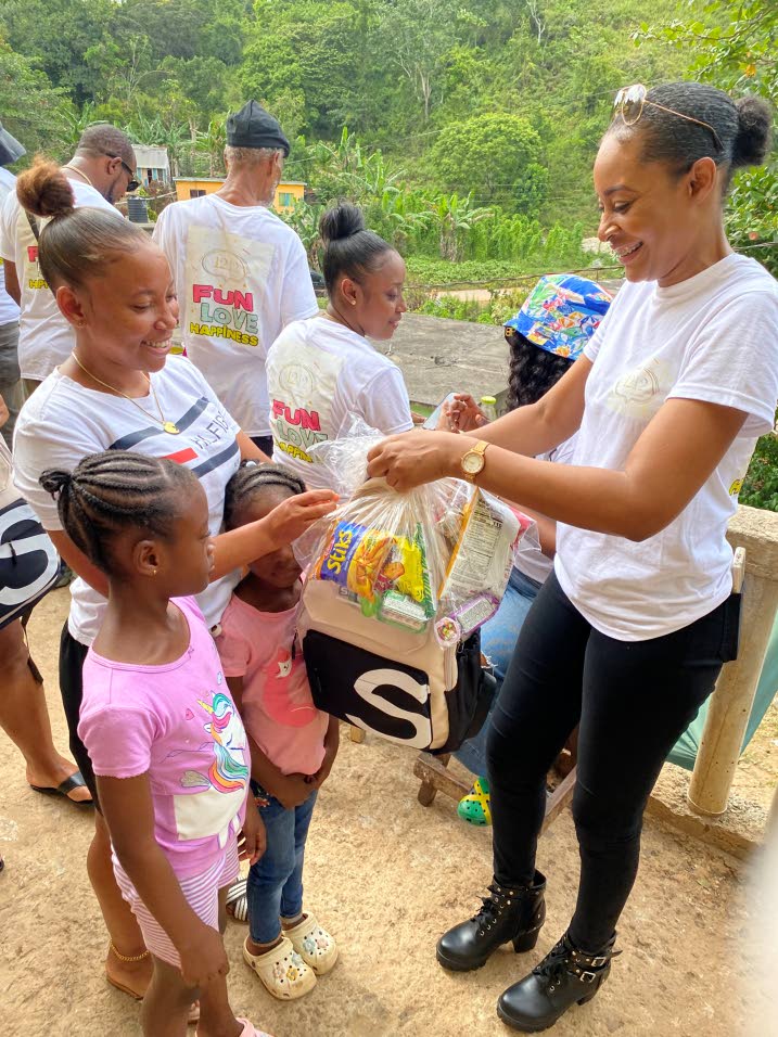 Home boy treats residents of Linton Park, St Ann - Jamaica Observer