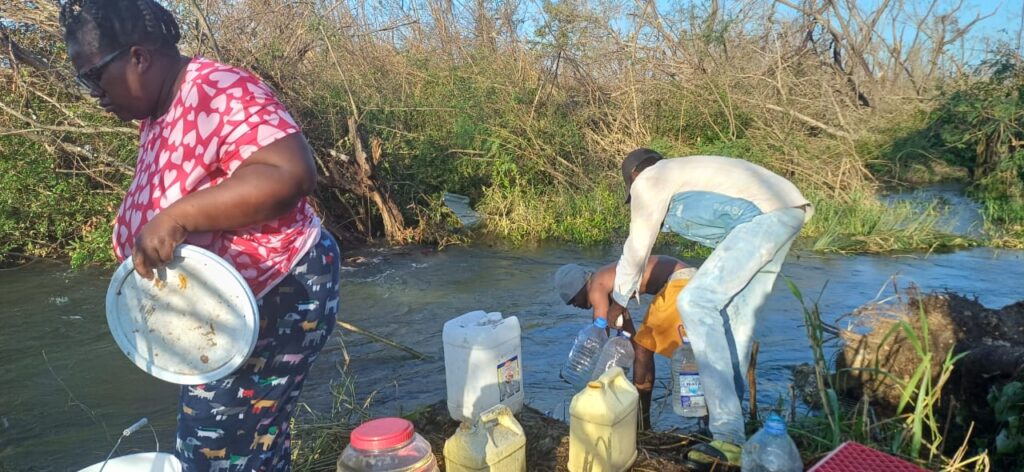 Trelawny residents join long queues to fetch river water after ...
